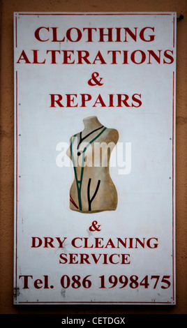Laundry & dry cleaning services sign Stock Photo - Alamy