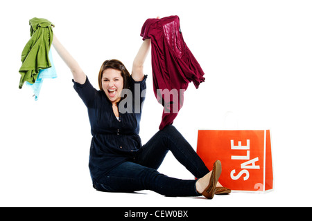 Beautiful young excited happy trendy girl with hand on hip looking away ...