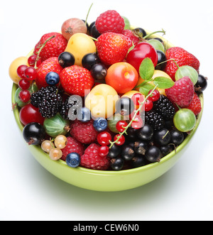 Red and white currants and cherries in a small round pile against a ...