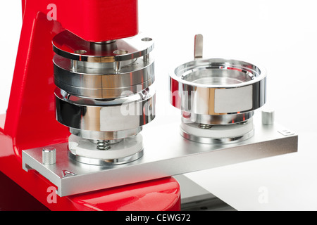 Mechanical hand press for the production of badges Stock Photo - Alamy