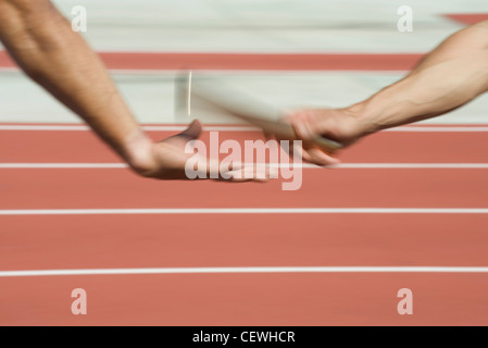 Track & Field. Runners In A Relay Race, Passing Baton Stock Photo ...