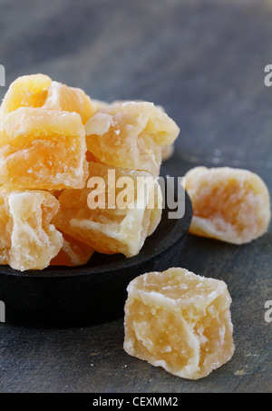 candied ginger on a dark background Stock Photo - Alamy