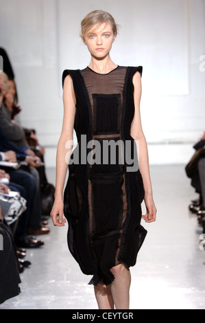 Paco Rabanne Female model blonde hair pulled back wearing a military ...