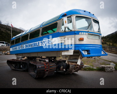Snow Coach tour bus at the Athabasca Glacier. The Athabasca is the most ...