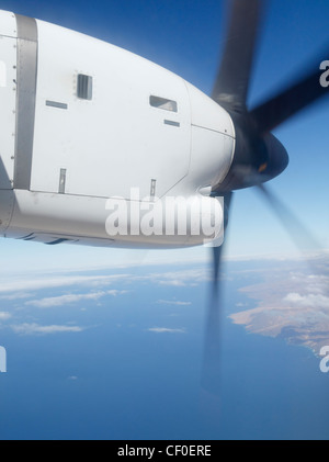 Airplane propeller from window seat of twin prop plane Stock Photo - Alamy