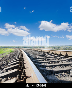 low view to railroad under deep blue cloudy sky Stock Photo - Alamy