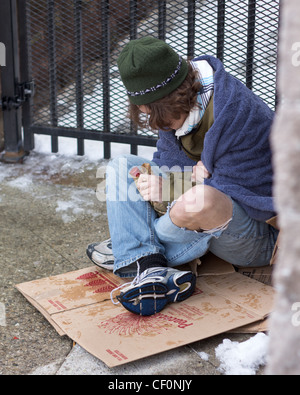 Alcoholic homeless man drinking on street Stock Photo - Alamy