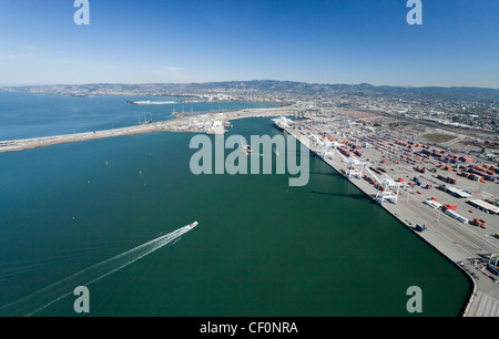 The Oakland Outer Harbor aerial view. Loaded trucks moving by Container cranes Stock Photo - Alamy