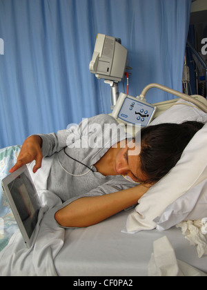 A young girl with anorexia nervosa is treated in hospital by being fed ...