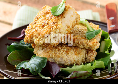 fried chicken in sesame seeds with salad Stock Photo - Alamy