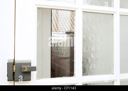 Front door with a broken window pane from shattered glass Stock Photo ...