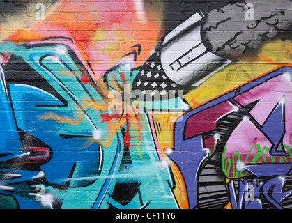 Graffiti explosion with vibrant colours on a textured wall Stock Photo ...