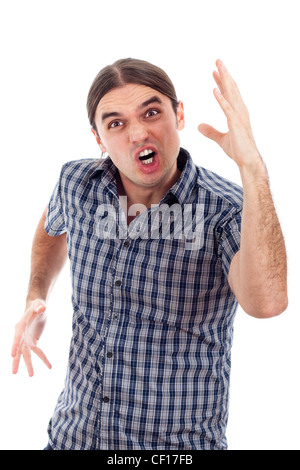 Angry mad young man gesturing with his finger against temple asking are ...