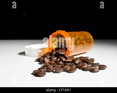 Coffee Beans Spill from Prescription Bottle Stock Photo - Alamy