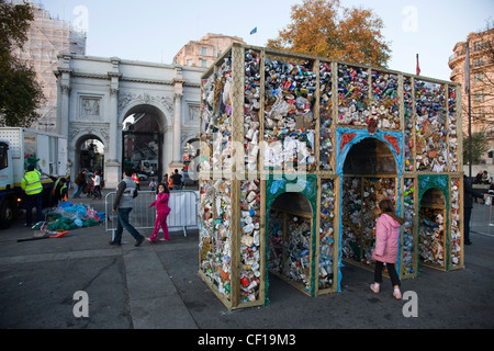 Structure made of rubbish in the shape of Marble Arch in front of the ...