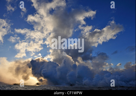 Steam rising off lava flowing into ocean, Kilauea Volcano, Hawaii ...