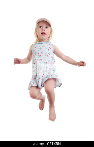 Cute little girl jumping on white background Stock Photo - Alamy