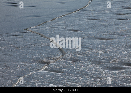 Cracking ice floating on lake Stock Photo - Alamy