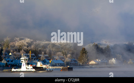 The Corran ferry port with hoarfrost covered woodland behind Stock ...