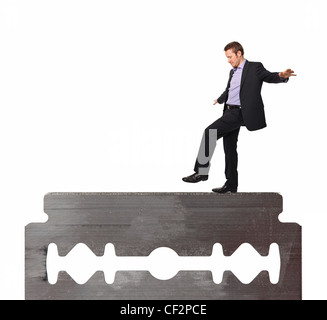 man try to walk on razor blade Stock Photo - Alamy