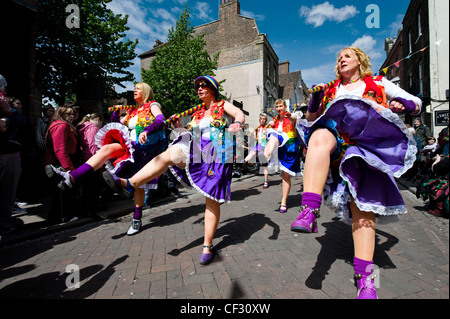 Traditional folk Morris dancers, the Loose Women Morris side, dancing ...