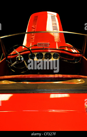 Open top red Ferrari sports car in a traffic queue on a summers day in ...