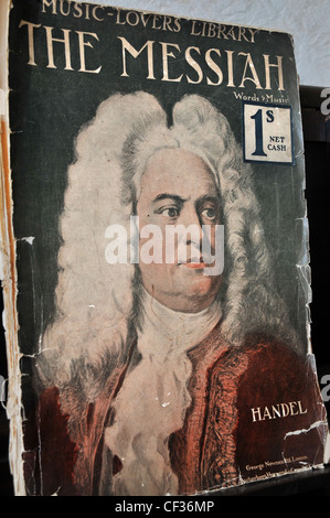 An old musical volume of Handel's 'The Messiah' sits on top of a piano ...