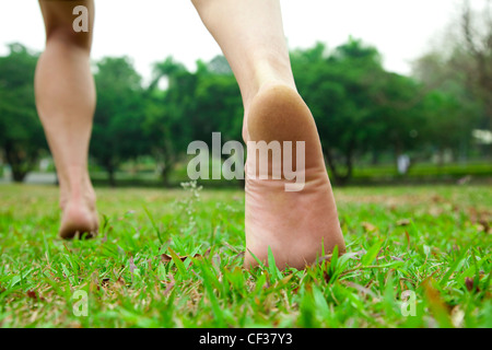 Man's feet running Stock Photo - Alamy