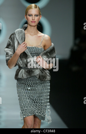 Paco Rabanne Female model blonde hair pulled back wearing a military ...