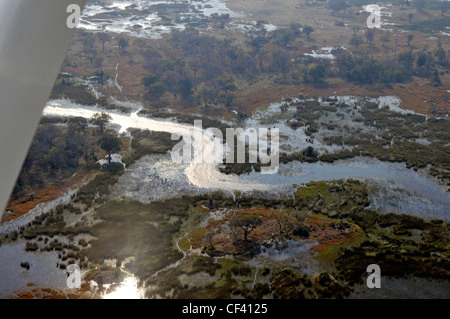 Africa Namibia The Okavango River flows over Popa Falls at dusk in the ...