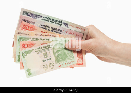 Many diverse Indian rupee bills with the portrait of Mahatma Gandhi are ...