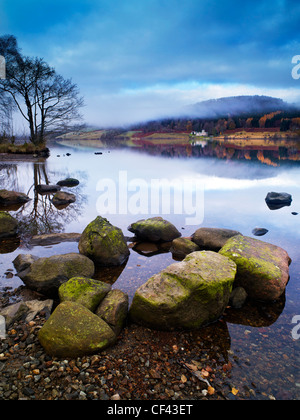 shoreline view with rocks of Loch Rannoch Scotland and the a distant ...