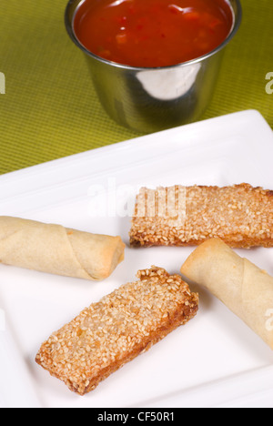 A mix of Chinese starters with sweet chili sauce Stock Photo - Alamy