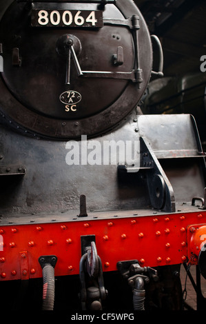 The front of a restored steam engine at sheds in Horsted Keynes Railway ...