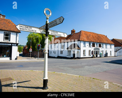Overton village centre, Hampshire, England, UK, with a family walking ...