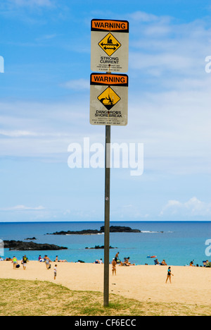 Dangerous shore break warning sign at Sandy Beach, Oahu, Hawaii, with a ...