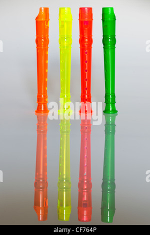 Four plastic toy flutes Stock Photo - Alamy