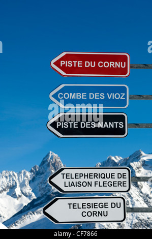 Directional signs to red, blue, and black ski slopes at Planpraz ...