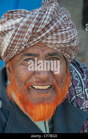 Middle-aged Indian Muslim man with Muslim goatee wearing a white ...
