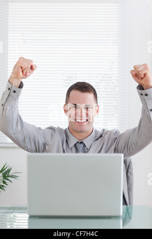 Businessman celebrating a great success Stock Photo - Alamy