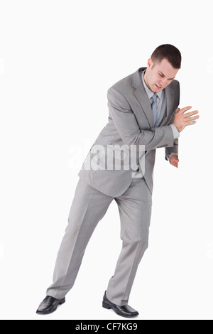 Man pushing invisible wall Stock Photo - Alamy