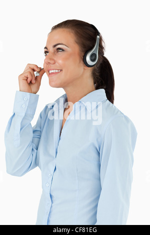side view of beautiful female call center operator in headset at ...