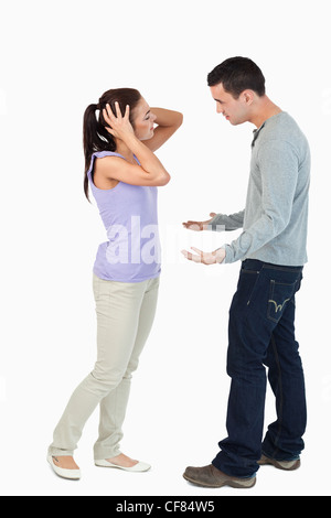 Cute couple having argument while standing on the stairs Stock Photo ...