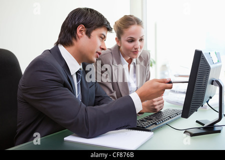 Focused business team working with computer in modern office Stock ...