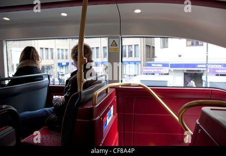 Interior upper deck of London Routemaster bus. Wide shot from rear ...