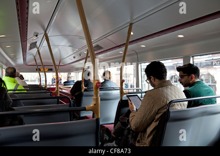 Interior upper deck of London Routemaster bus. Wide shot from rear ...