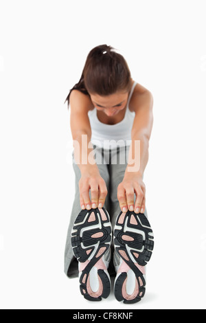 Getting her muscles warmed up. Healthy young woman in sportswear ...