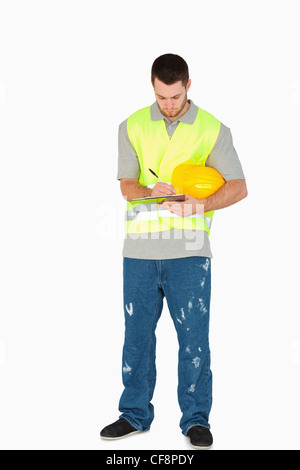 Young construction worker taking notes Stock Photo - Alamy