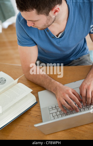 Student copying something from his book Stock Photo - Alamy