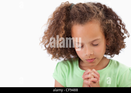 Cute girl praying Stock Photo - Alamy